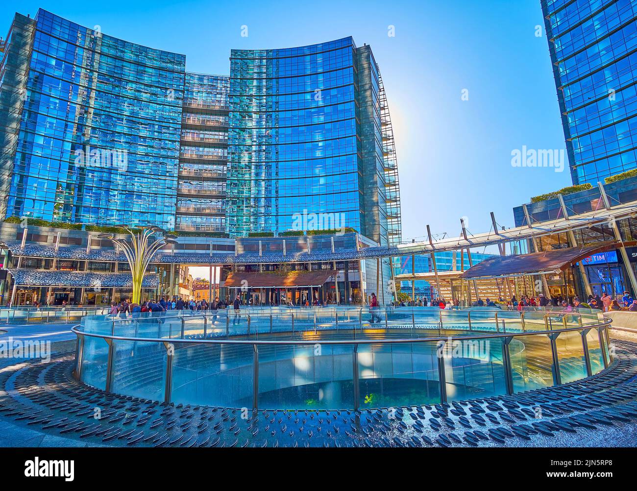 MILAN, ITALY - APRIL 9, 2022: Piazza Gae Aulenti square with glass ...