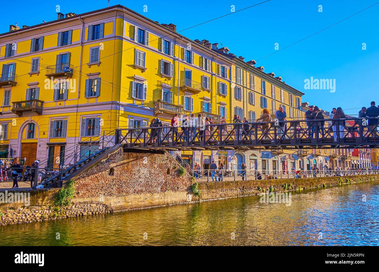 MILAN, ITALY - APRIL 9, 2022: The old metal bridge and the colorful ...