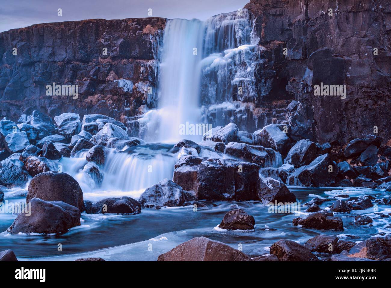 Water flowing over rocks in a waterfall cascade Stock Photo - Alamy