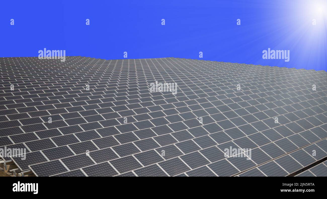Large surface of Solar Panels on blue sky, Photovoltaic solar cells ...