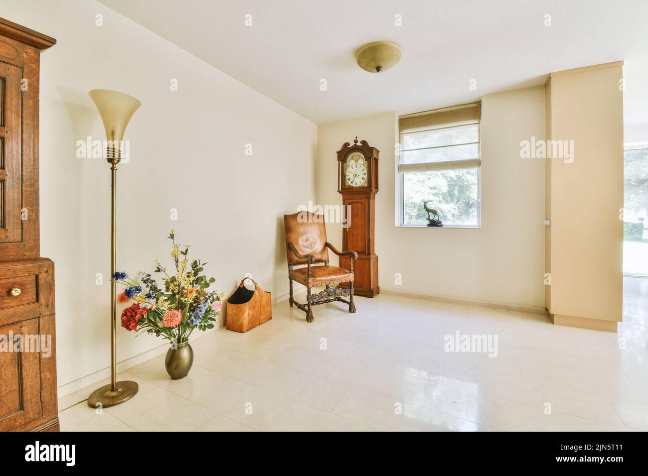 Interior of living room with comfortable sofa and TV against windows in ...