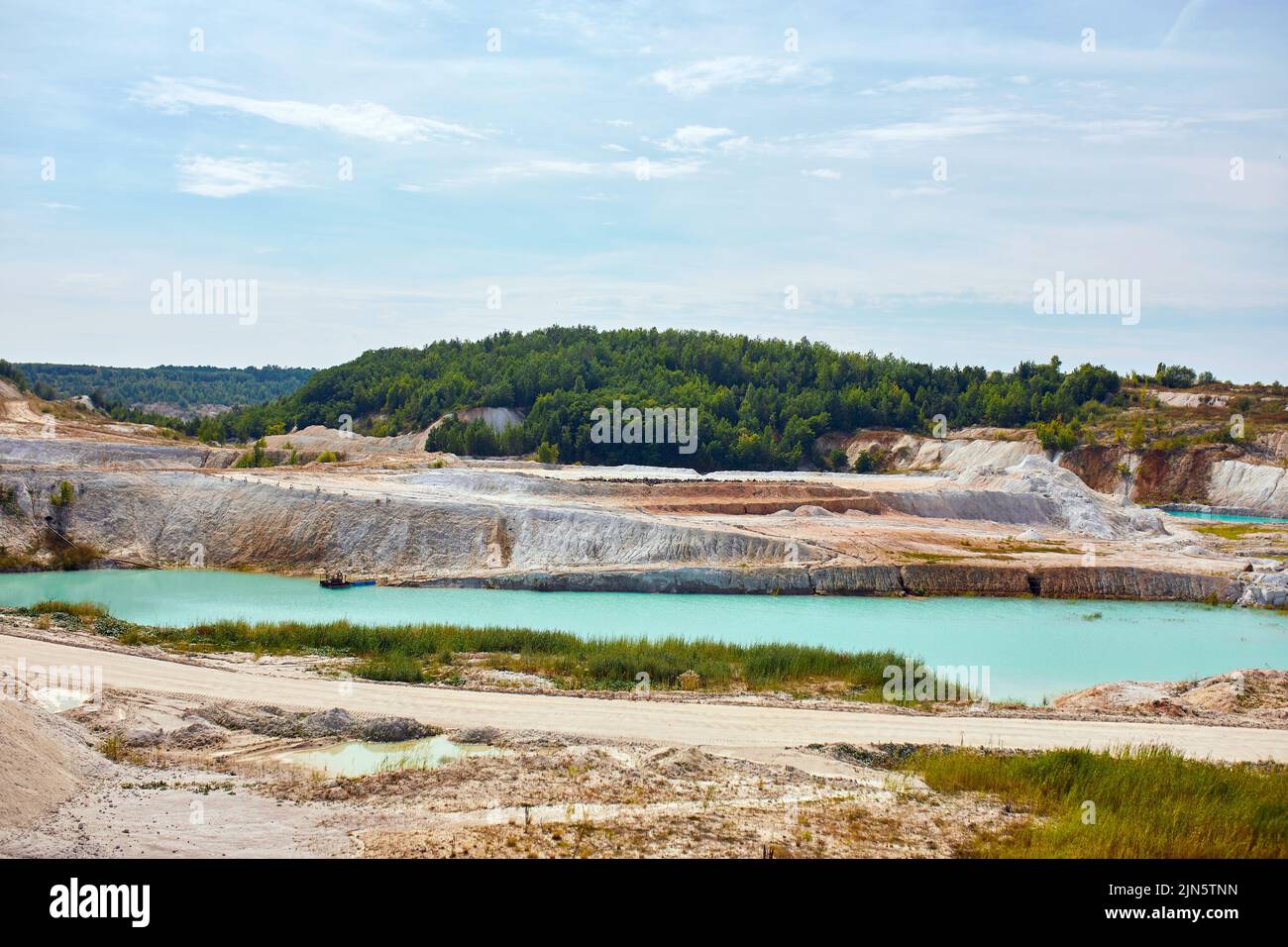 Quarry extraction porcelain clay, kaolin, with turquoise water and ...