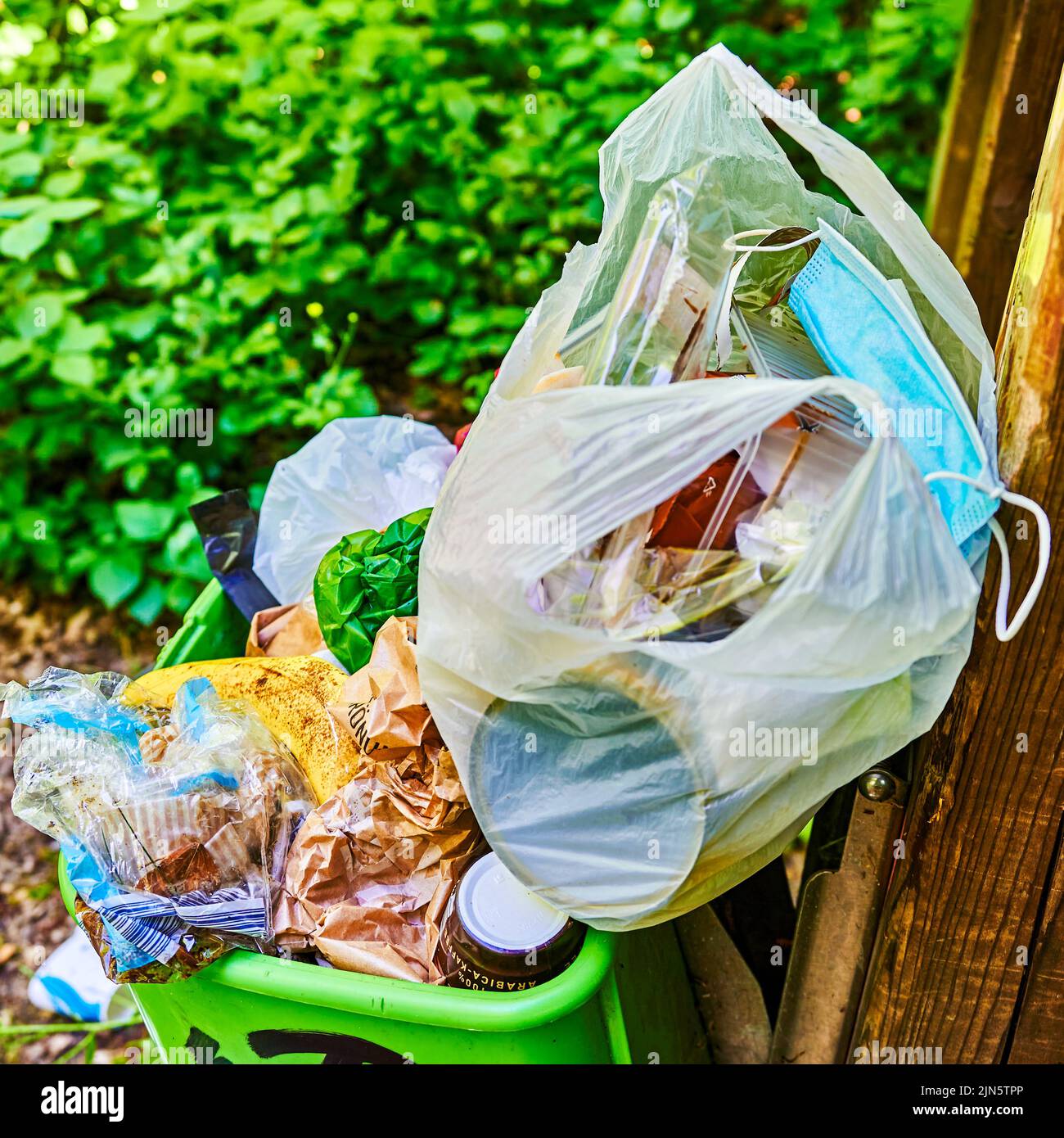 Berlin, Germany - June 10, 2022: Overfilled dustbin and waste in a ...