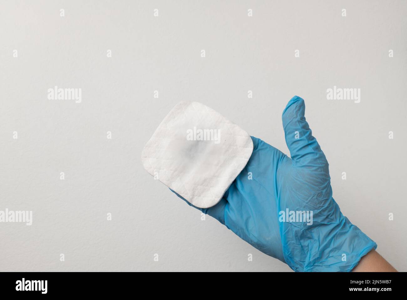 hadn holding white cotton sponges on white background. Design for the ...