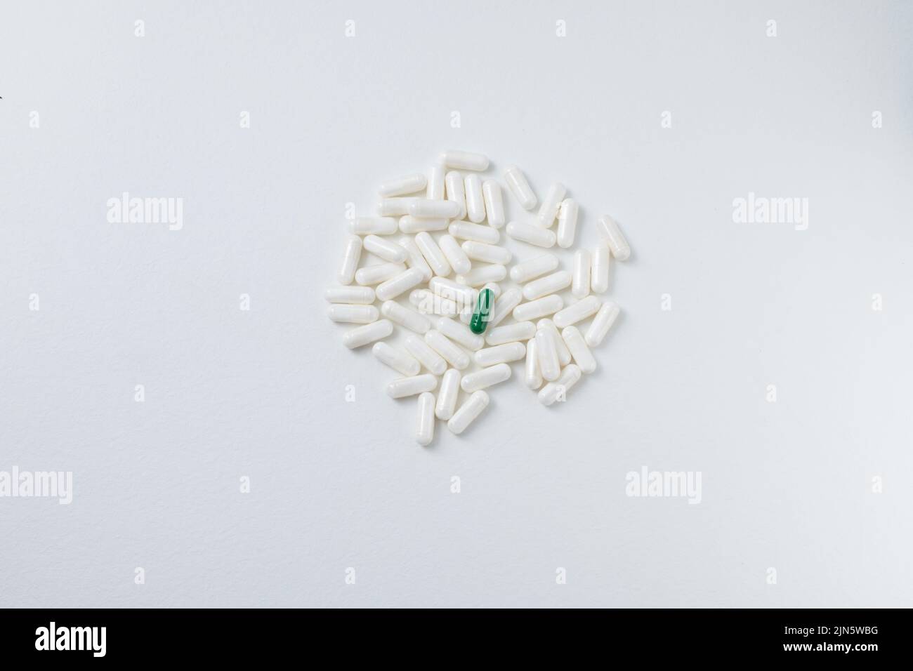 Pile of pill on white table. Top view of pile white pill painkiller ...