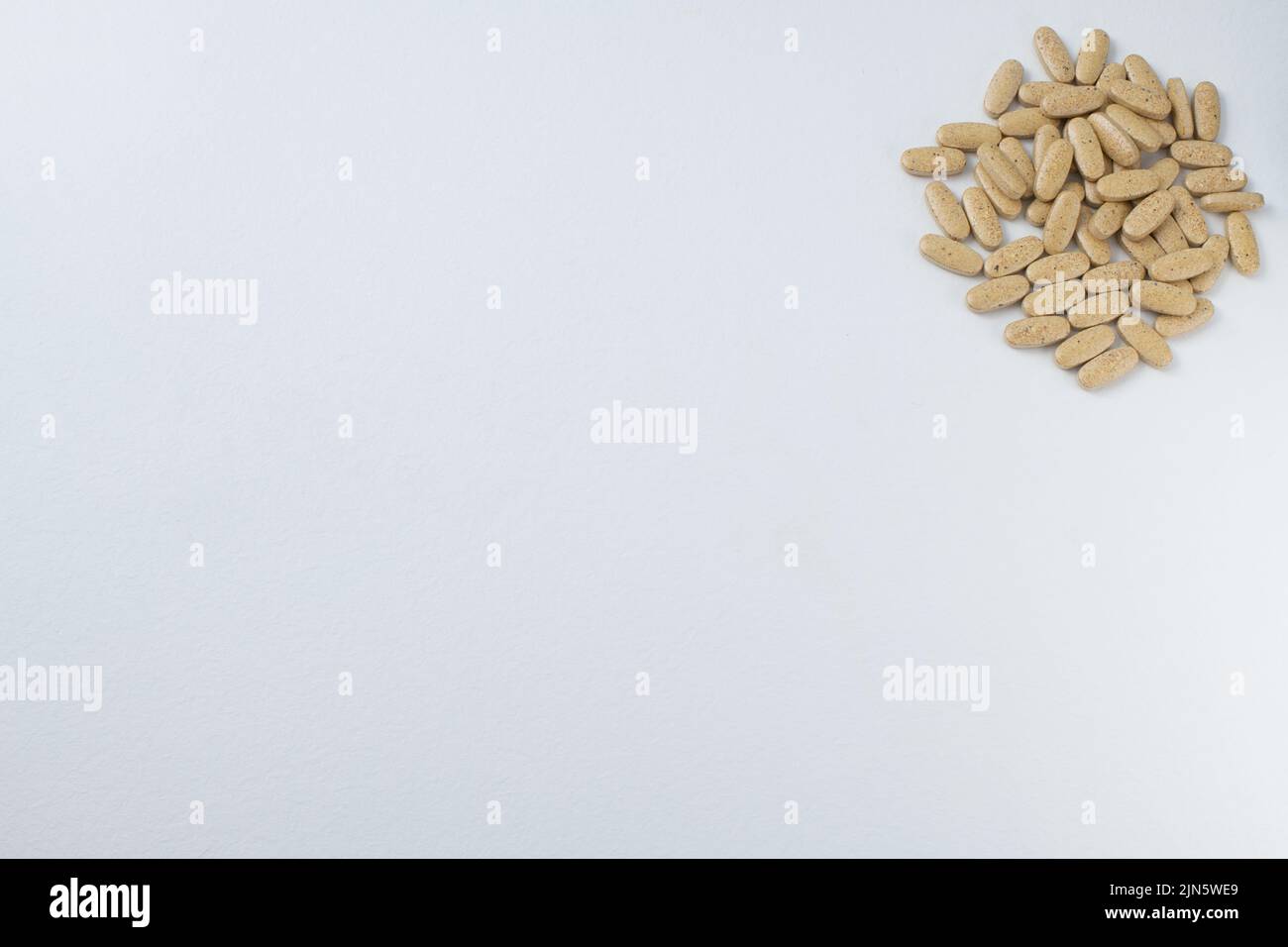 Brown pills, medicine isolated on white background, top view ...