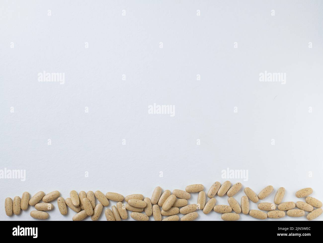 Brown pills, medicine isolated on white background, top view ...