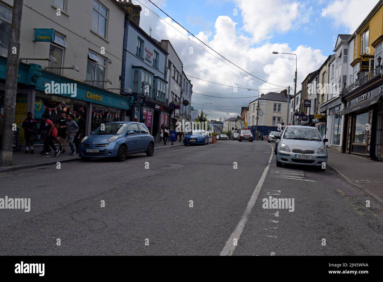 A view with people walking and shopping in Main Street, Mallow, County ...