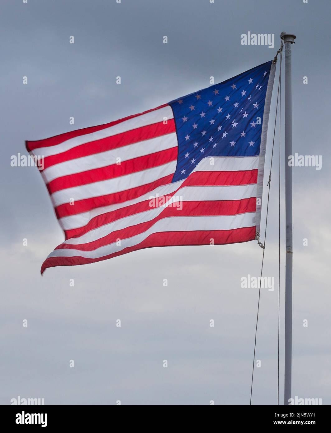 American flag waving fast with motion blur in the wind Stock Photo - Alamy