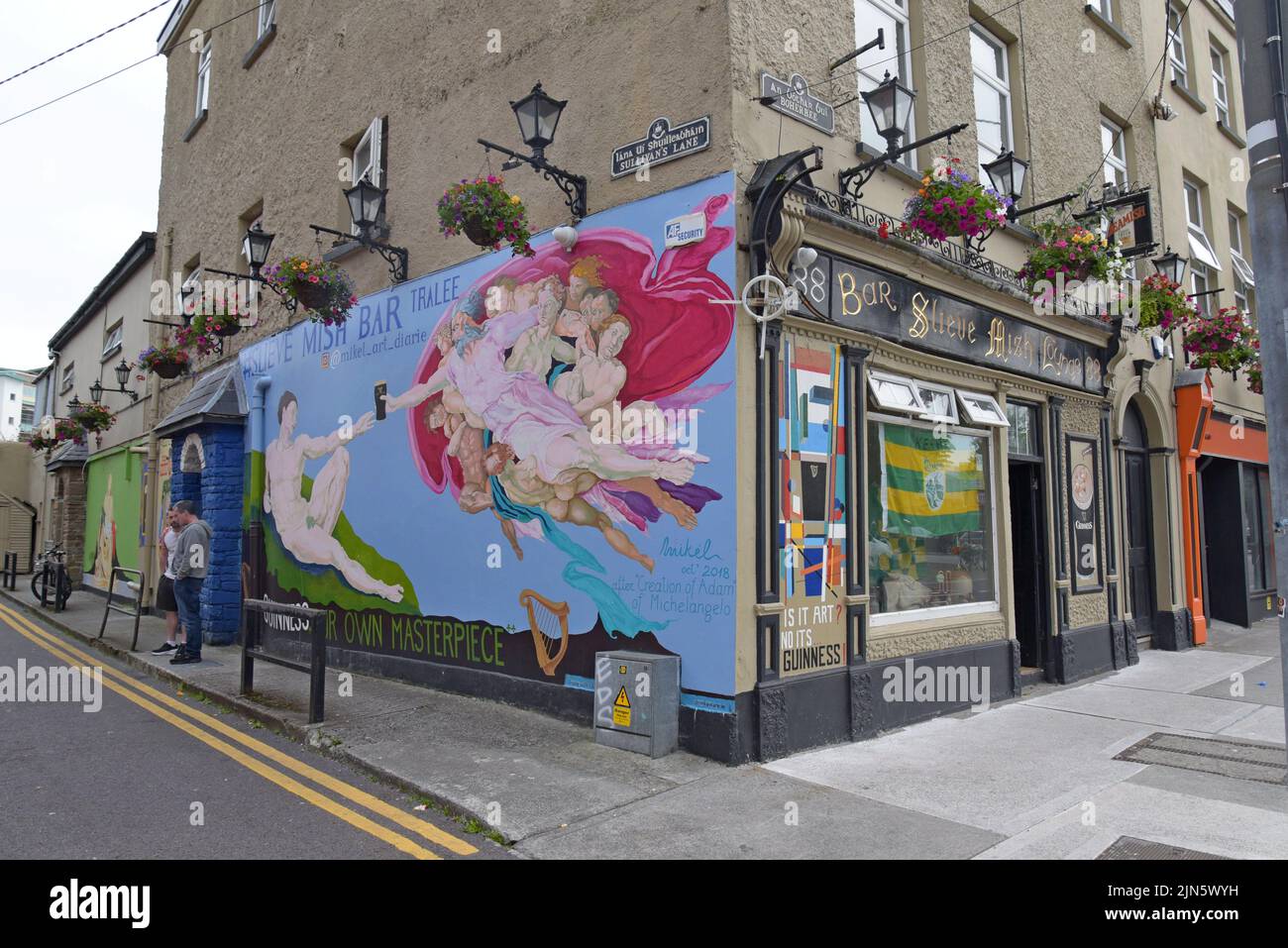 A parody mural of the Michaelangelo mural creation of Adam featuring ...