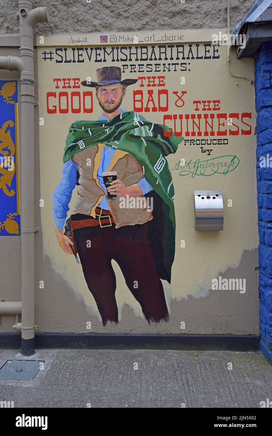 A Clint Eastwood Guinness parody mural on the outside wall of the ...