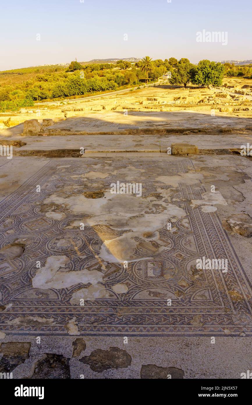 View of a Roman era mosaic floor of a public house, and the site ruins ...