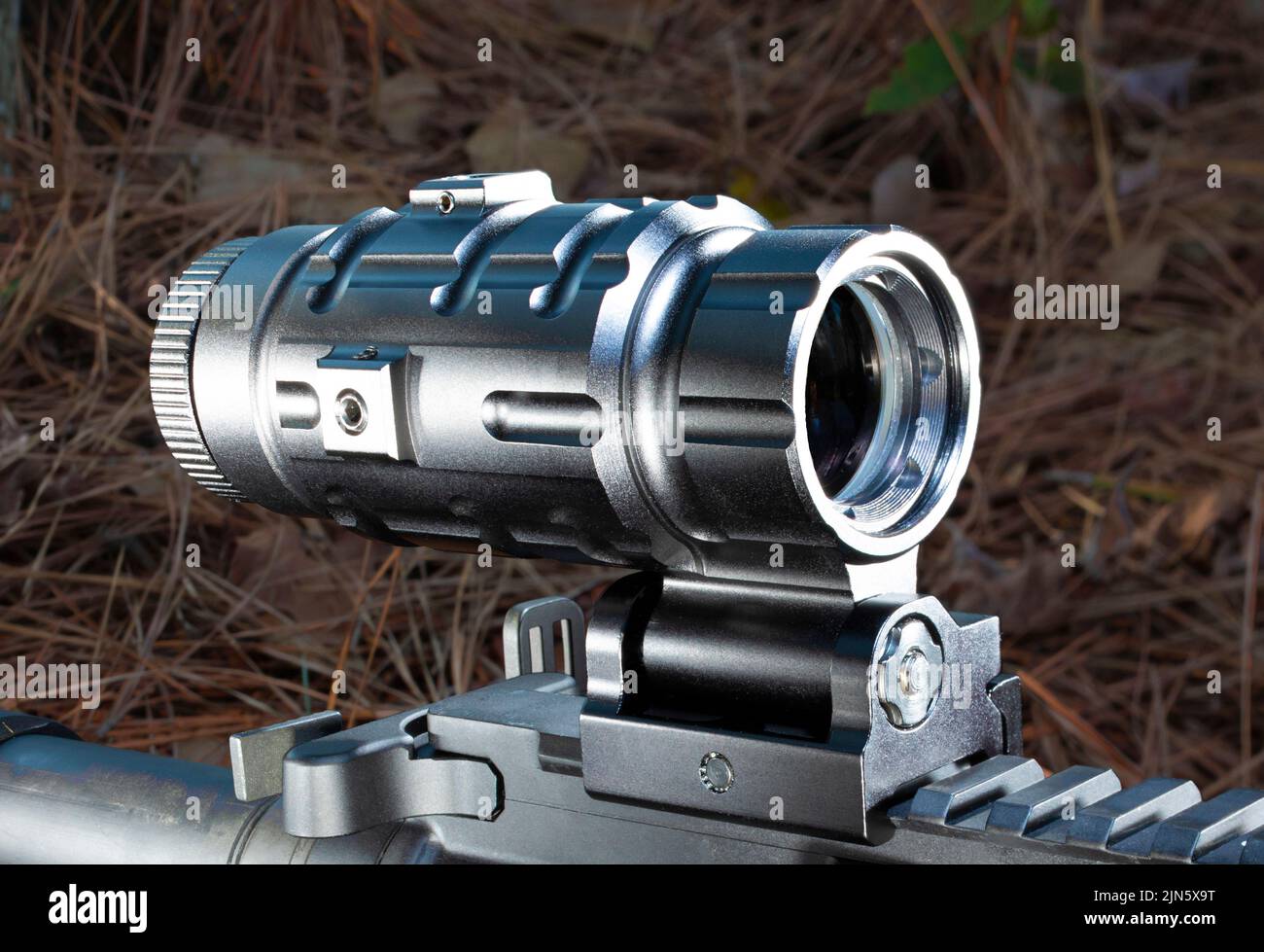 Sight magnifier mounted on an AR-15 rifle outdoors Stock Photo - Alamy