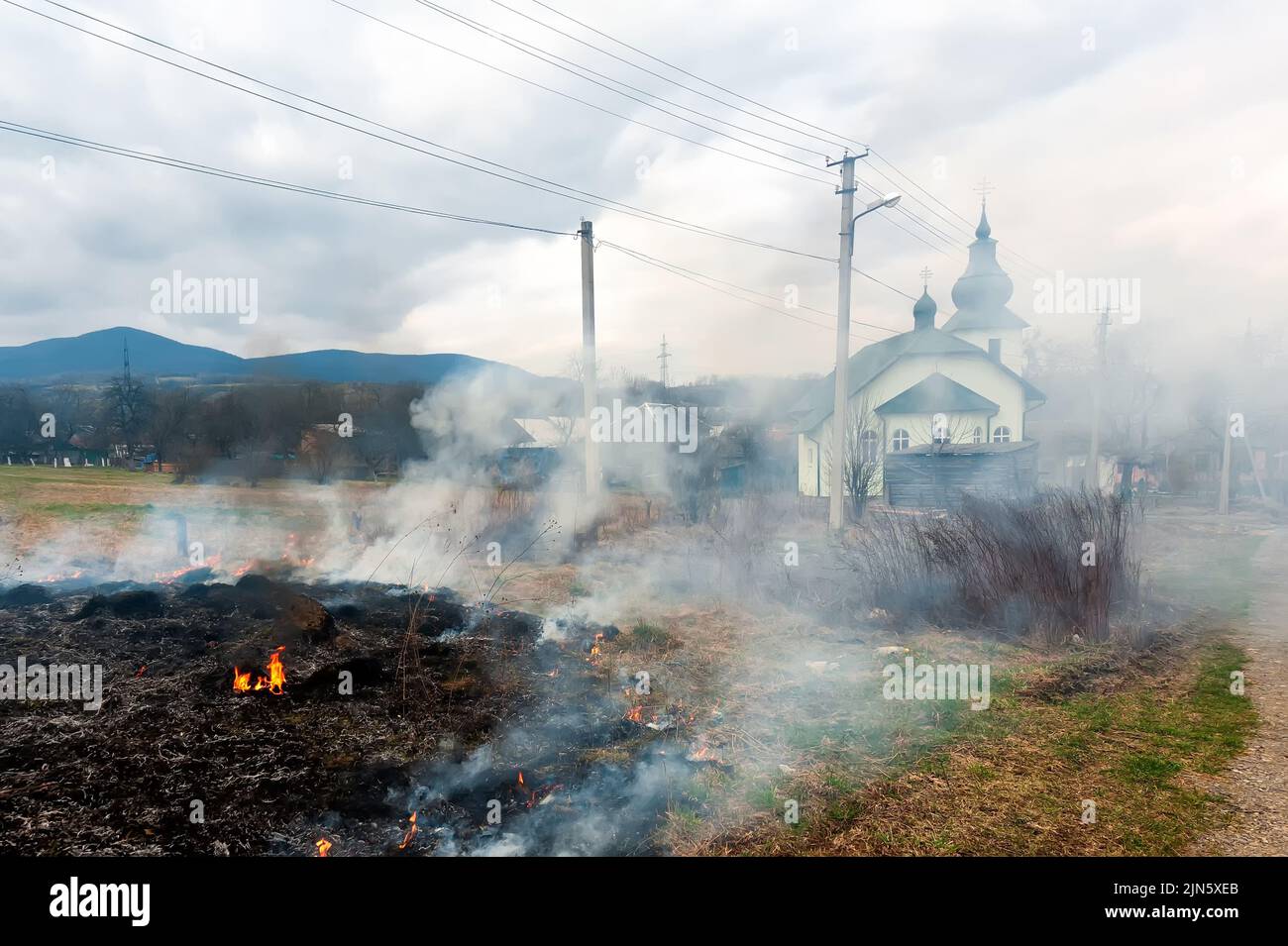 Spring arson of a grass in countryside in Ukraine Stock Photo - Alamy