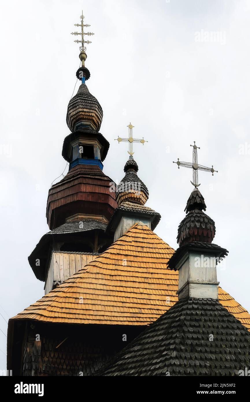 Colorful domes of wooden St. Michael`s Church, Svaliava, Ukraine Stock ...