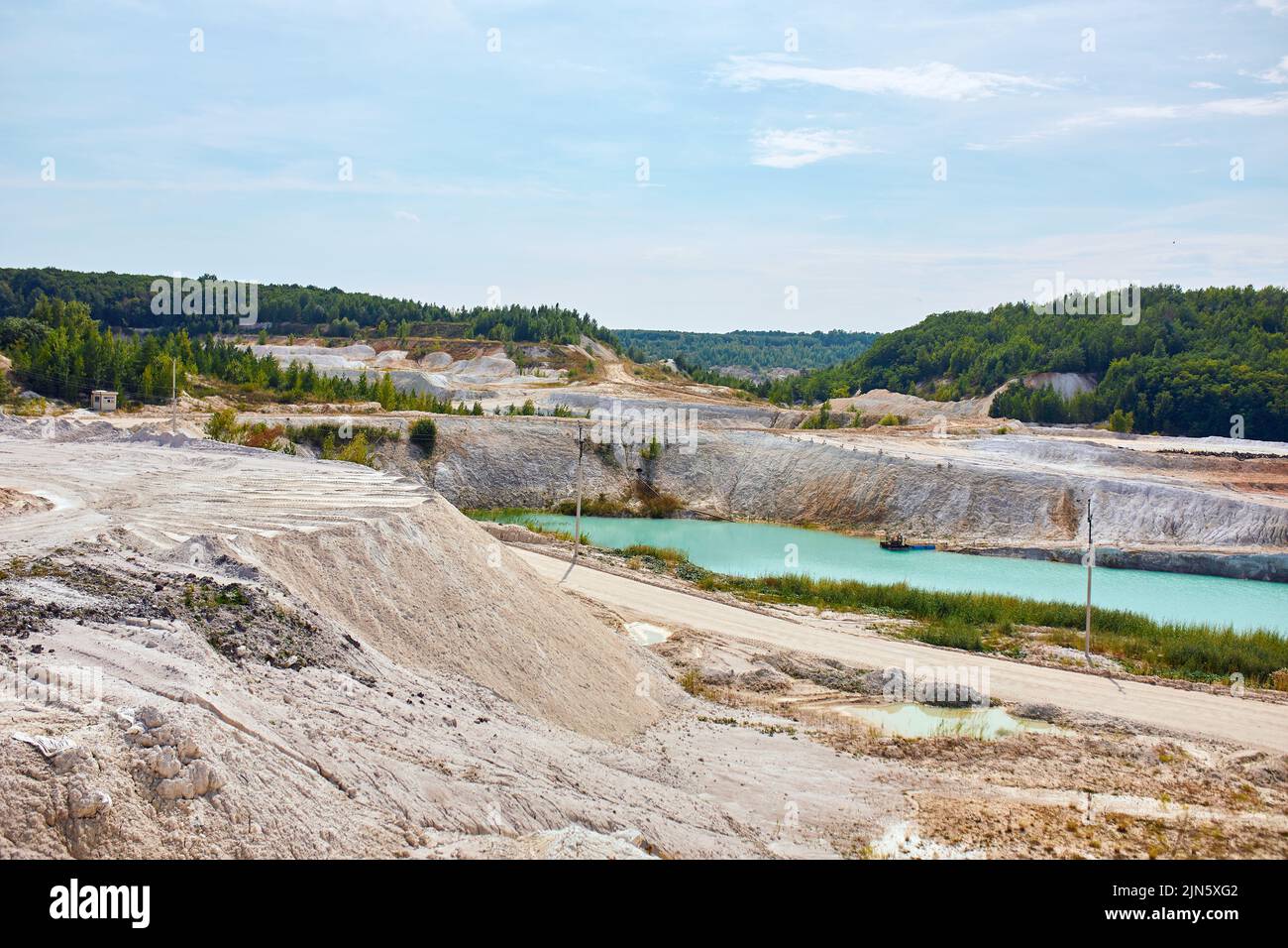 Quarry extraction porcelain clay, kaolin, with turquoise water and ...