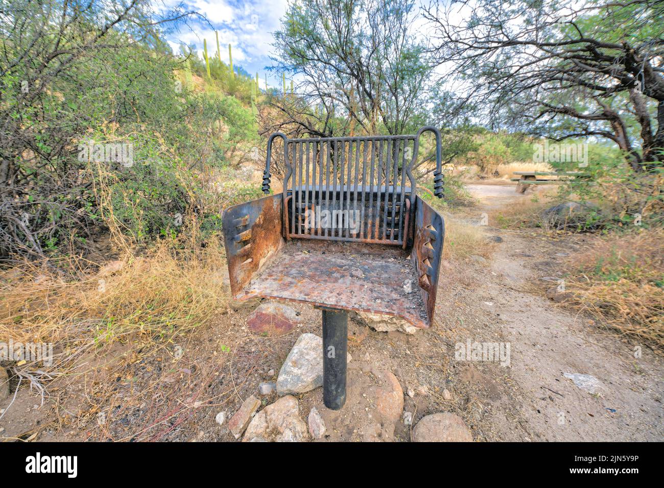 Camping grill post near the trail and picnic table at Tucson, Arizona ...