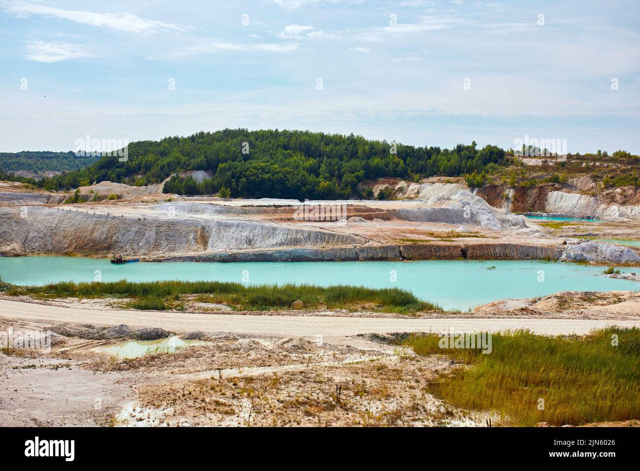 Quarry extraction porcelain clay, kaolin, with turquoise water and ...