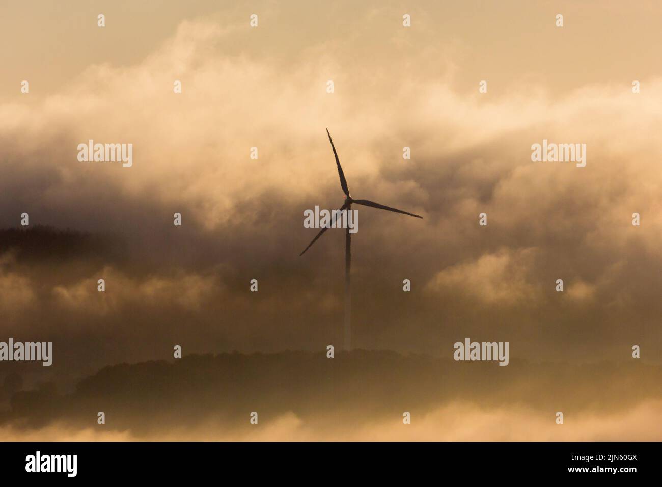 Wind turbines in misty morning Stock Photo - Alamy