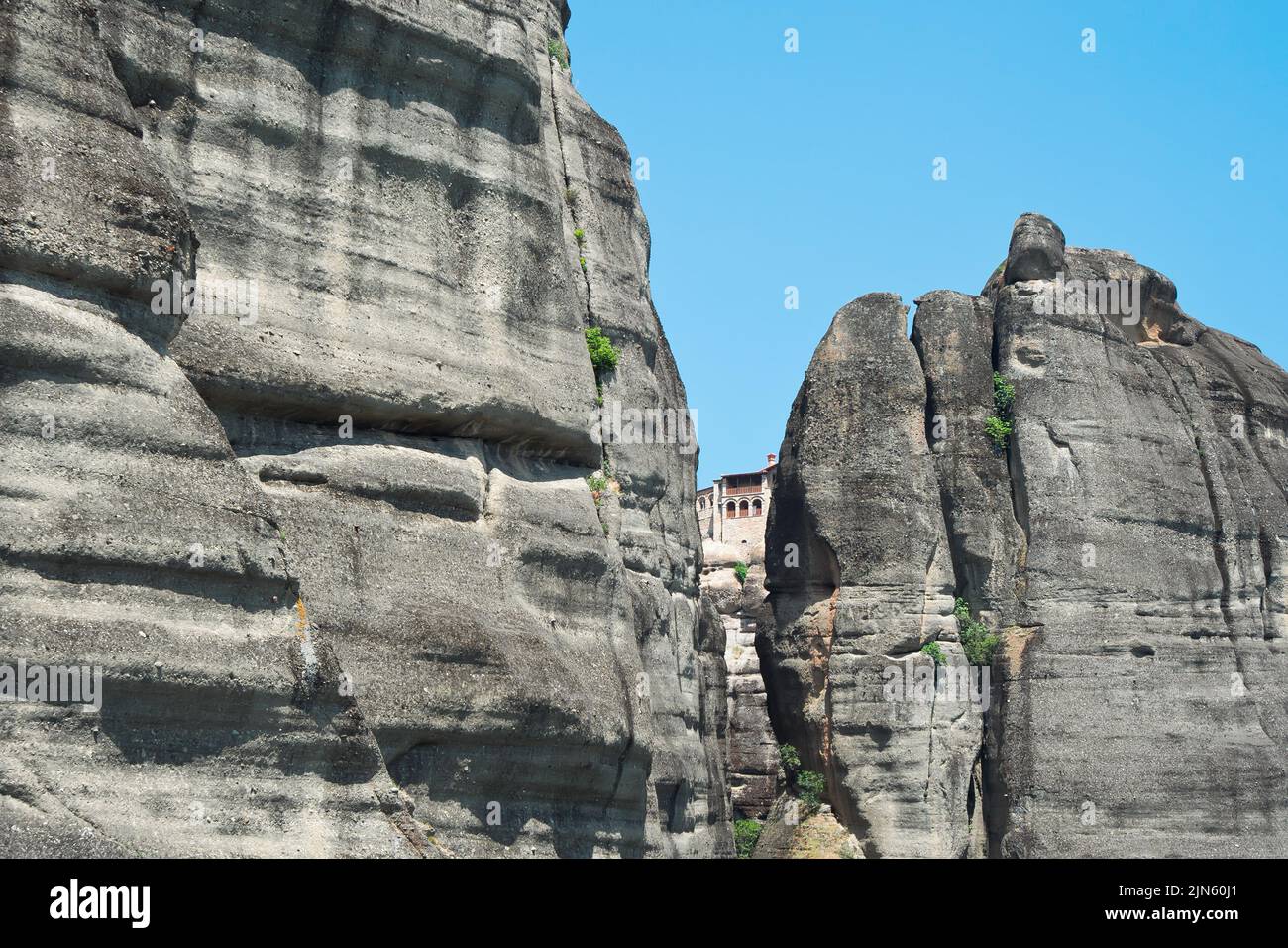 The mountain cleft through which a part of an orthodox monastery of ...