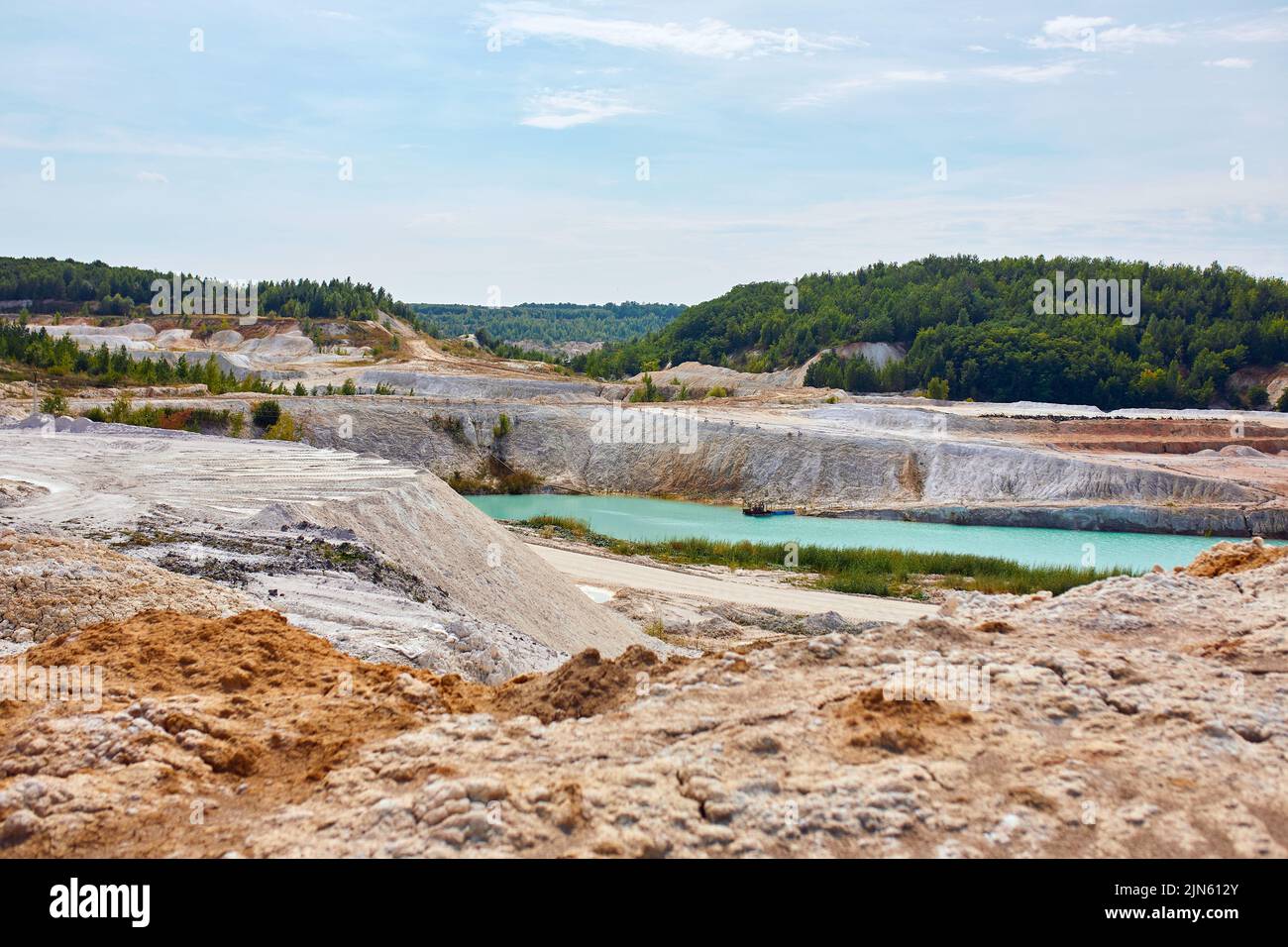 Quarry extraction porcelain clay, kaolin, with turquoise water and ...