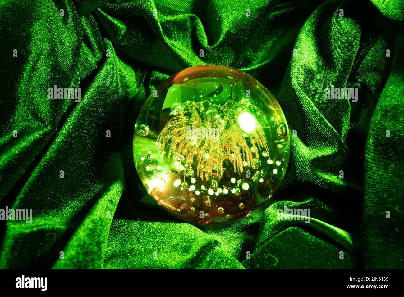 Closeup shot of a magic glass ball on the velvet cloth Stock Photo - Alamy