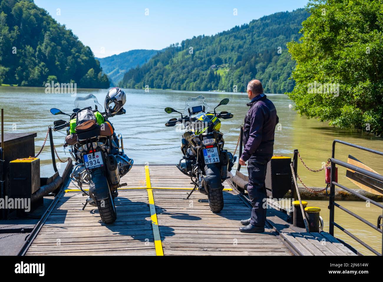 Alps, Austria - July 3, 2022: Small ferry with motorcycles on board ...