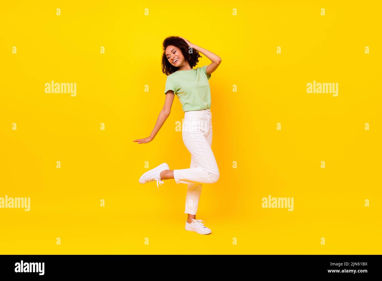 Full length photo of funny brunette lady dance wear t-shirt jeans shoes ...