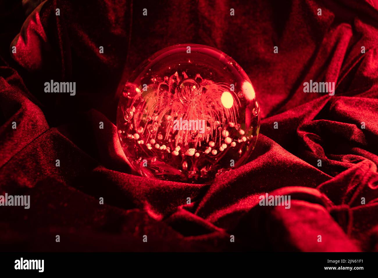 Closeup shot of a magic glass ball on the velvet cloth Stock Photo - Alamy