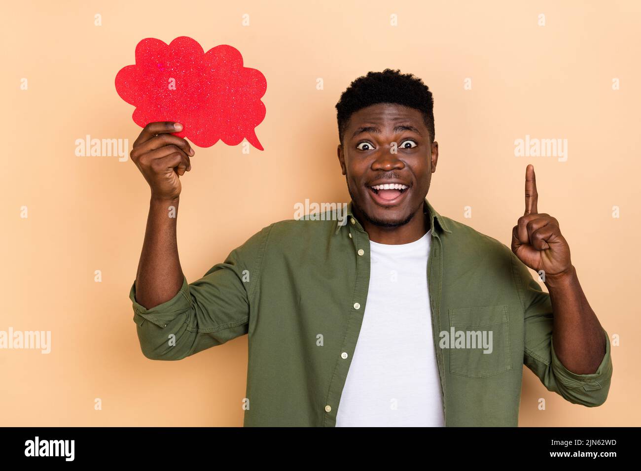 Photo of impressed millennial brunet guy have idea wear casual cloth ...