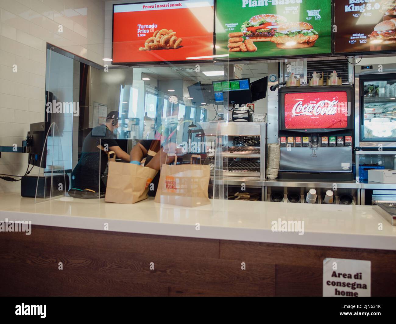 woman orders meal in the electronic touch screen terminal menu in the ...