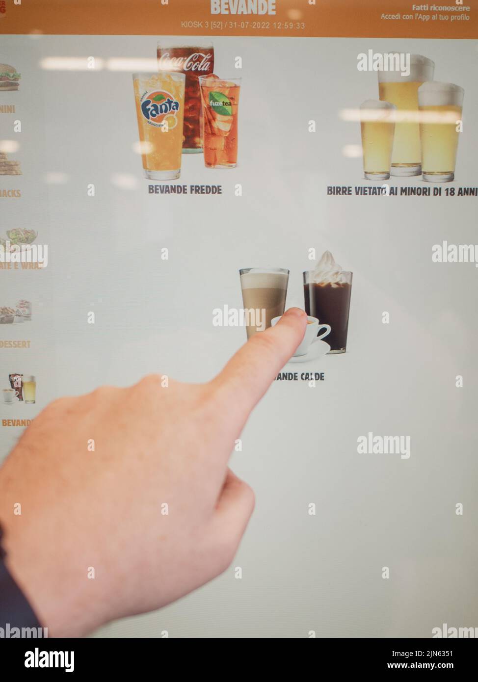 woman orders meal in the electronic touch screen terminal menu in the ...
