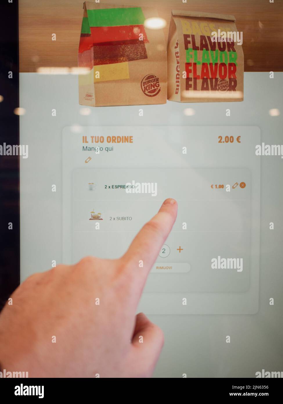 Woman Orders Meal In The Electronic Touch Screen Terminal Menu In The
