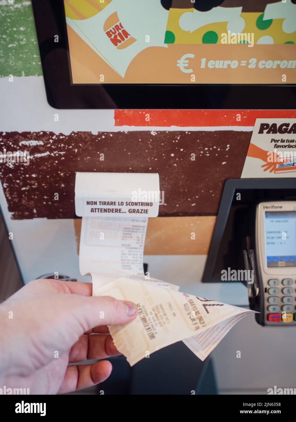woman orders meal in the electronic touch screen terminal menu in the ...