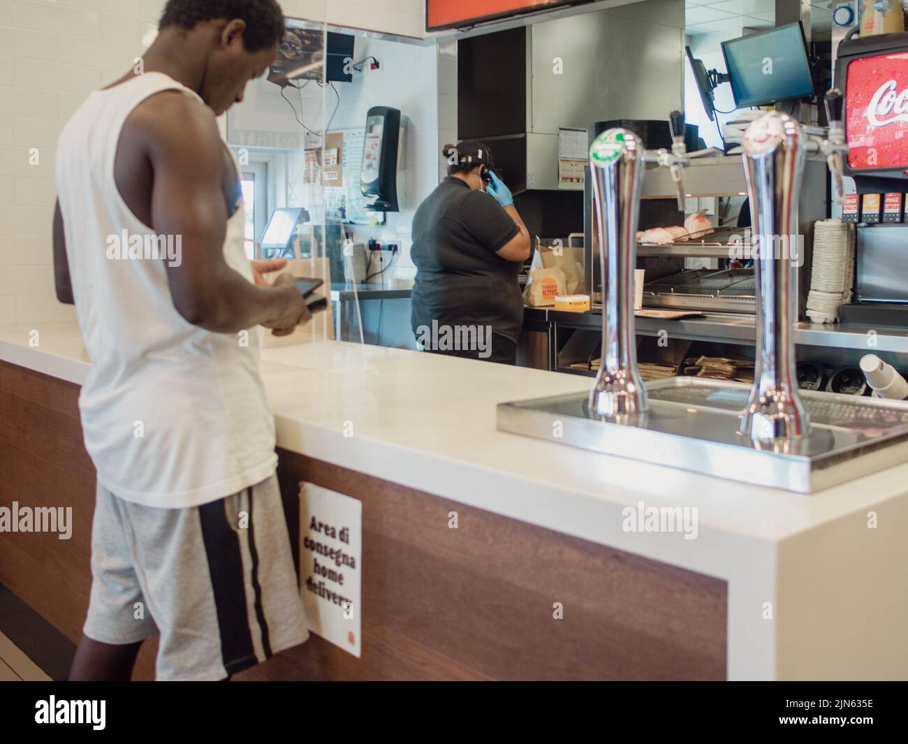 woman orders meal in the electronic touch screen terminal menu in the ...