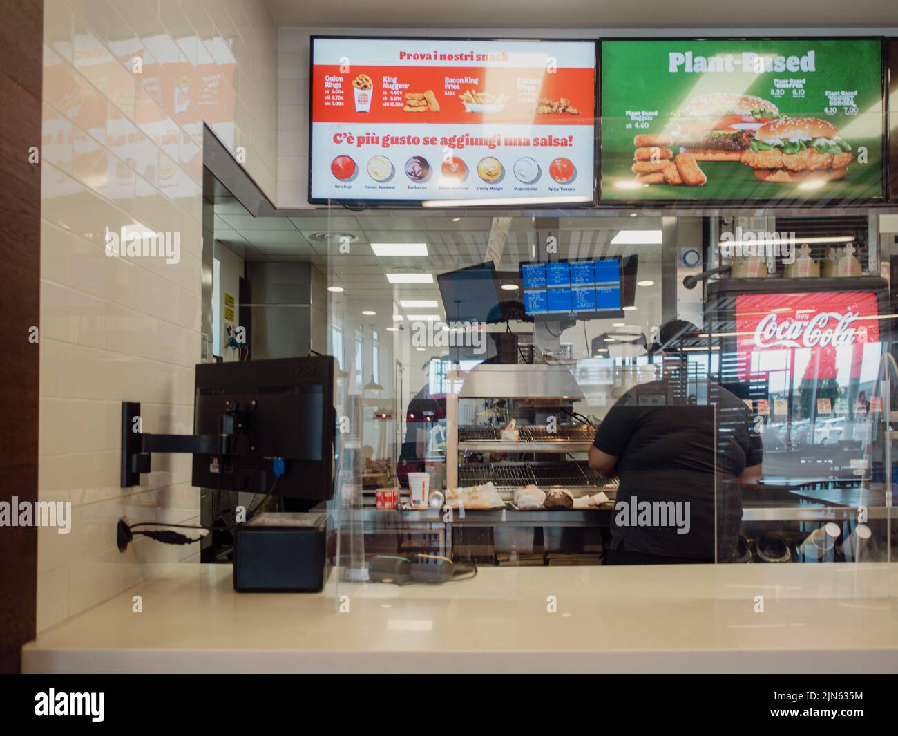 woman orders meal in the electronic touch screen terminal menu in the ...