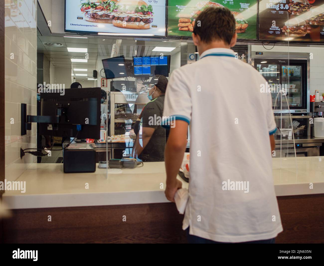 woman orders meal in the electronic touch screen terminal menu in the ...