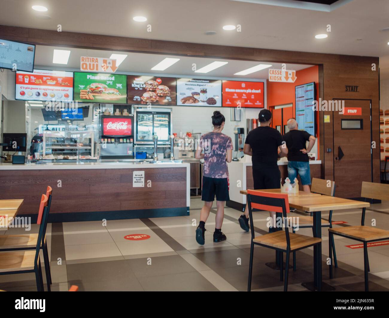 woman orders meal in the electronic touch screen terminal menu in the ...