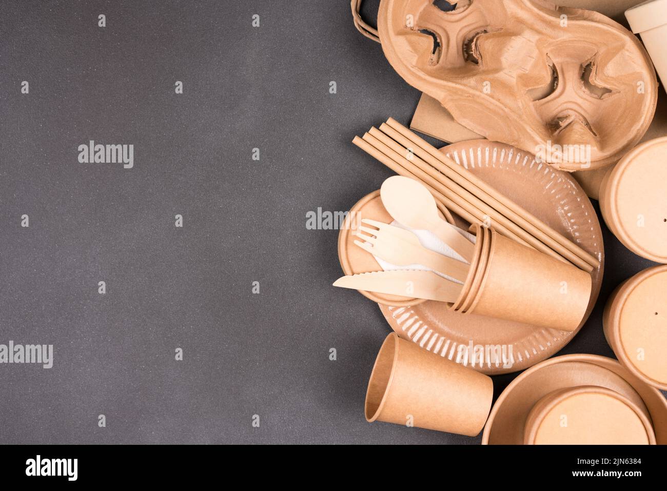 Paper utensils over dark concrete background with copy space - paper ...