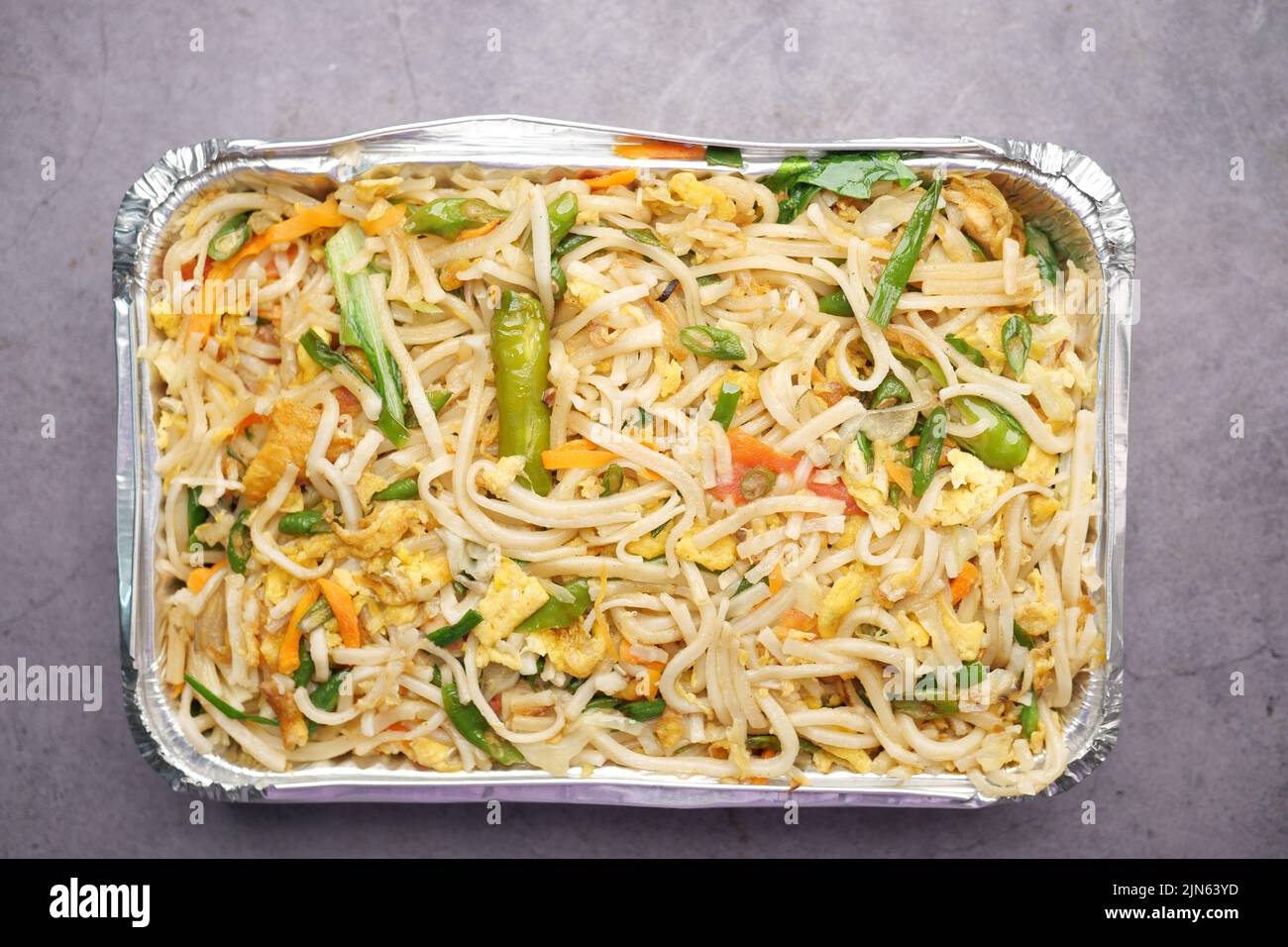 Curly Noodles in a take away packet top view Stock Photo - Alamy