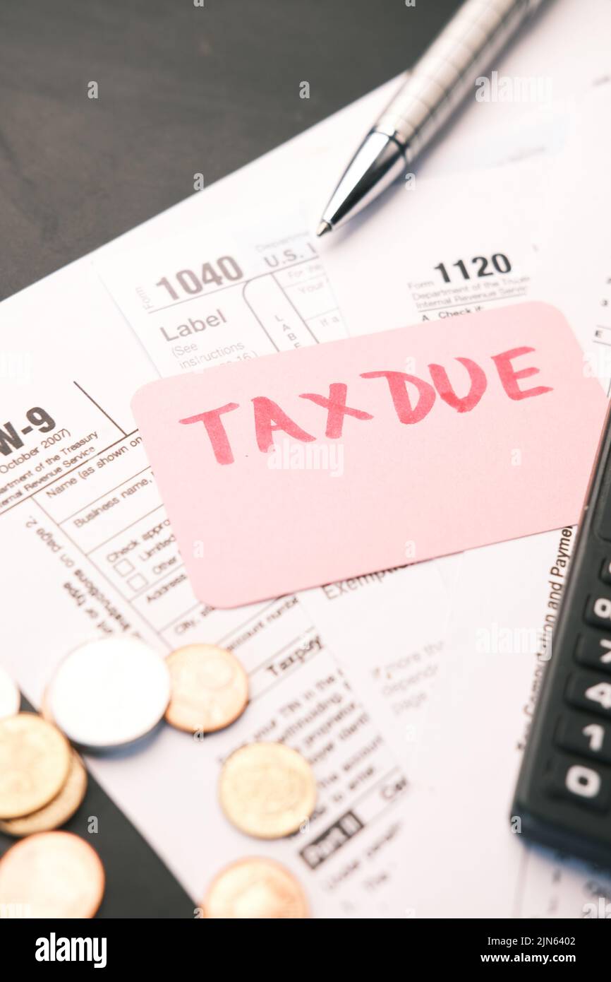 Tax return form and hand written tax due on table Stock Photo - Alamy