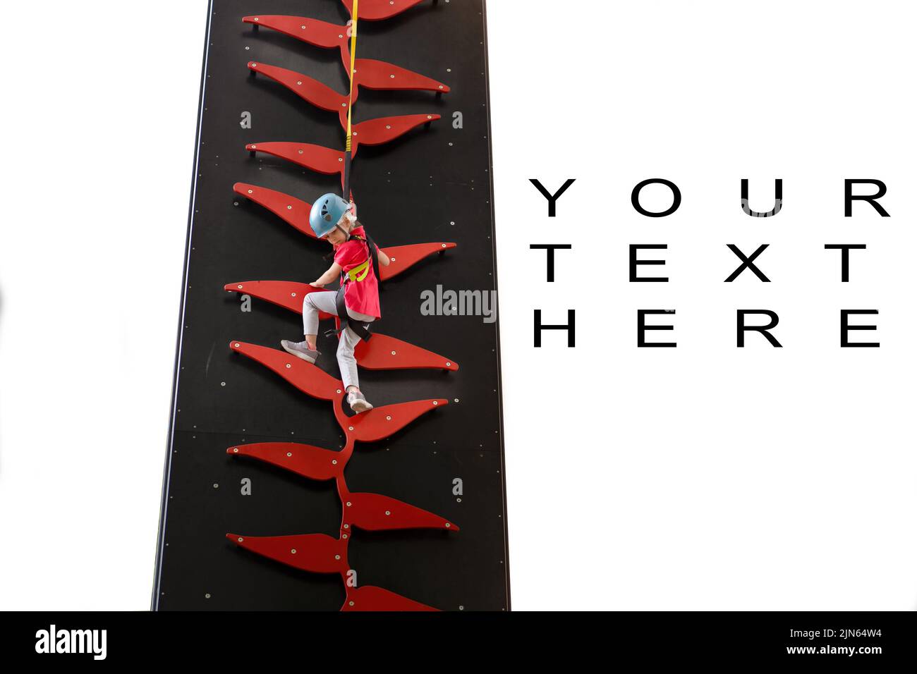 Child climbing on wall in amusement centre. Climbing training for ...