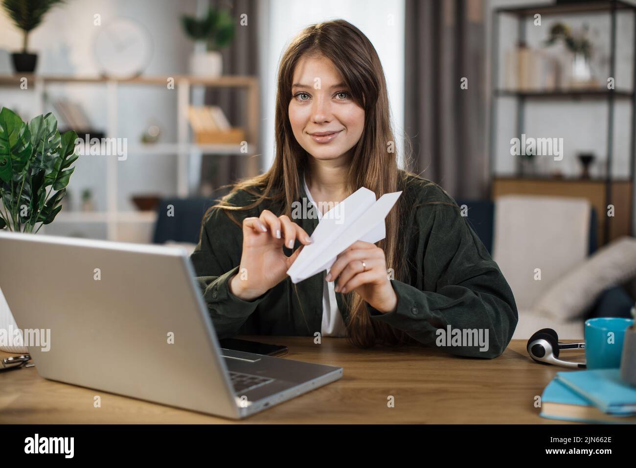 Woman paper airplane laptop hi-res stock photography and images - Alamy