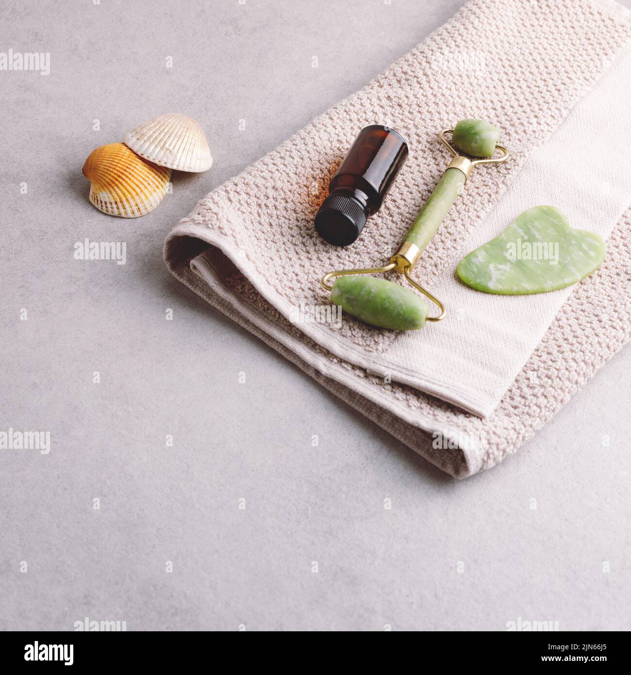 Square cosmetology background with gua sha massaging tools. Home spa ...