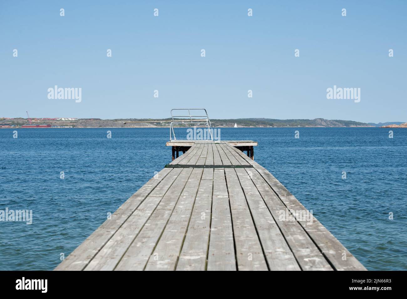 The empty dock against the background of blue sea and sky Stock Photo ...