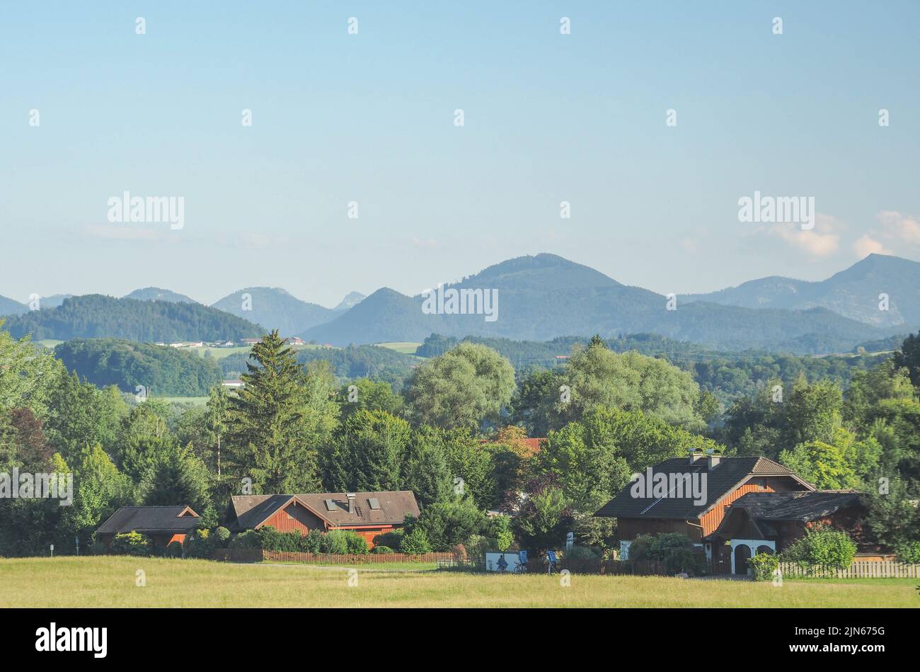 View of the village and the Alps from the window of a high-speed train ...