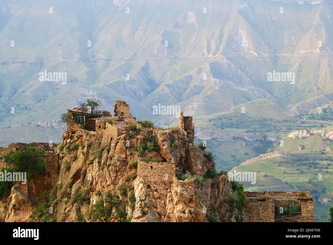 Ancient village Gamsutl on rock on background of mountains. Amazing ...