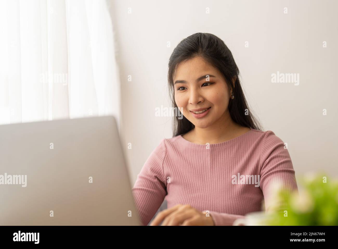 Asian woman working laptop. Business woman busy working on laptop ...