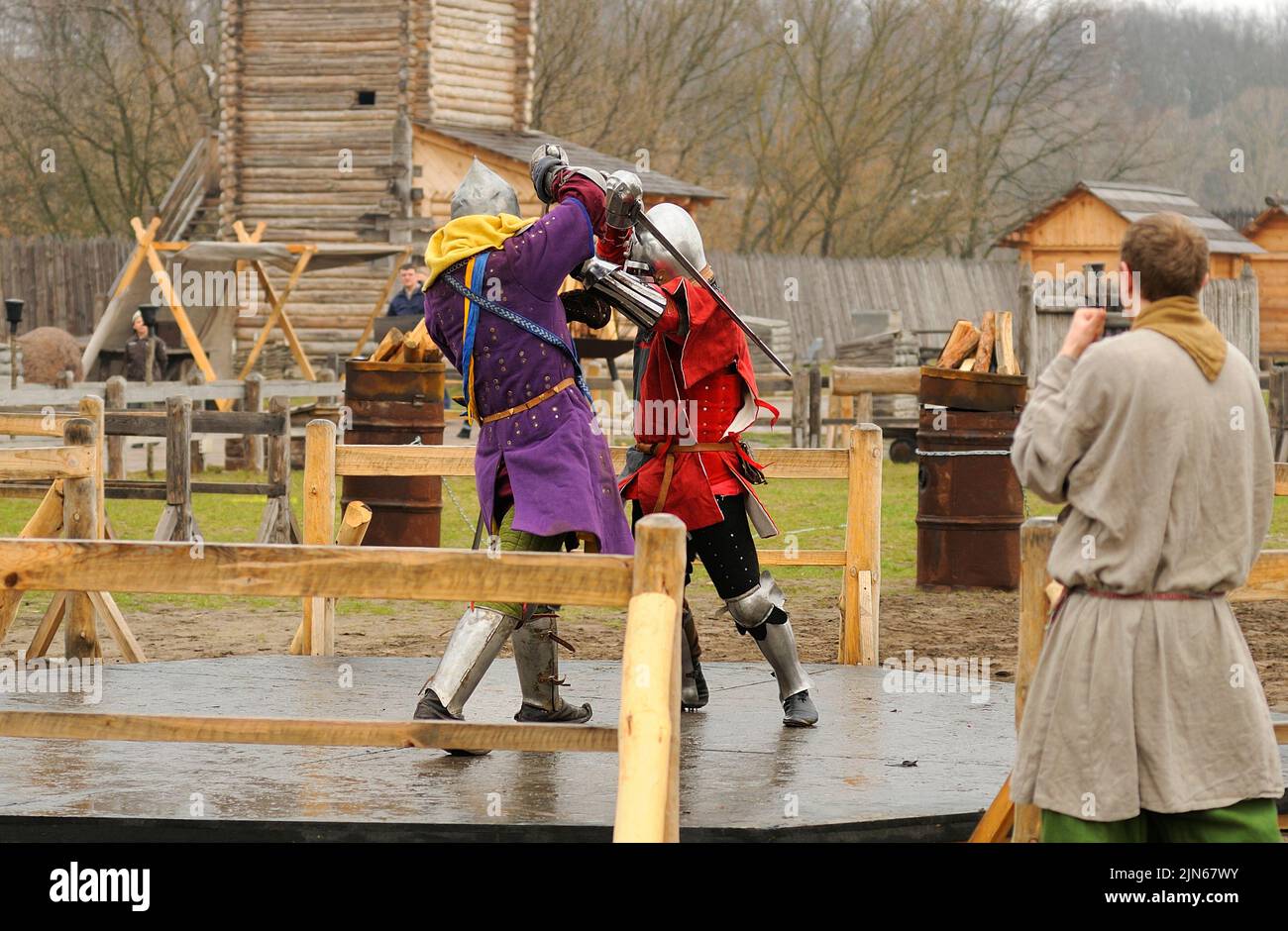 Men reenactors in metal armor of an Old Rus knights reconstructing ...