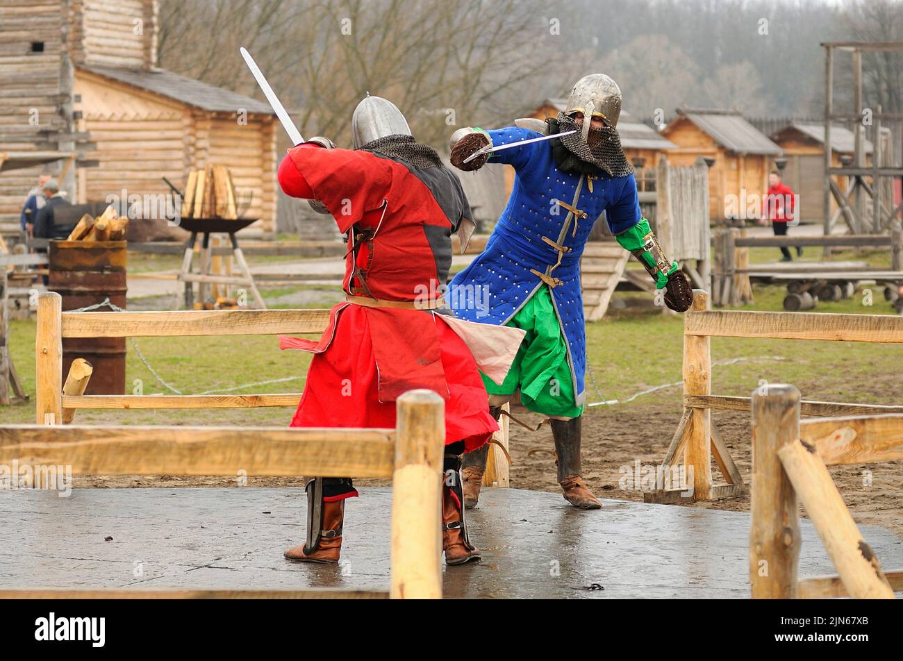 Men reenactors in metal armor of an Old Rus knights reconstructing ...
